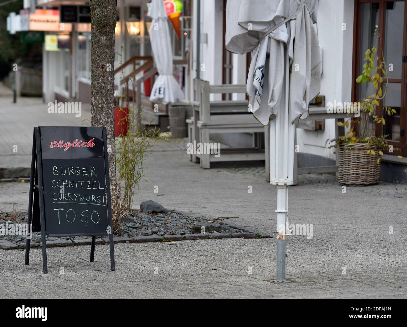 Winterberg, Germany. 19th Dec, 2020. In the empty city centre, a stand ...