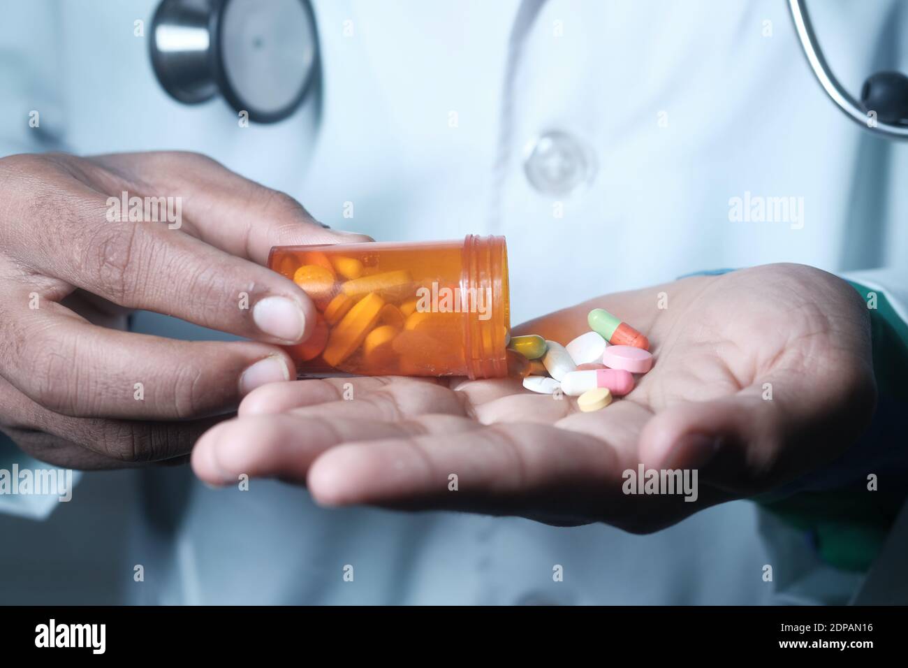 Doctor hand holding pill container hi-res stock photography and images ...