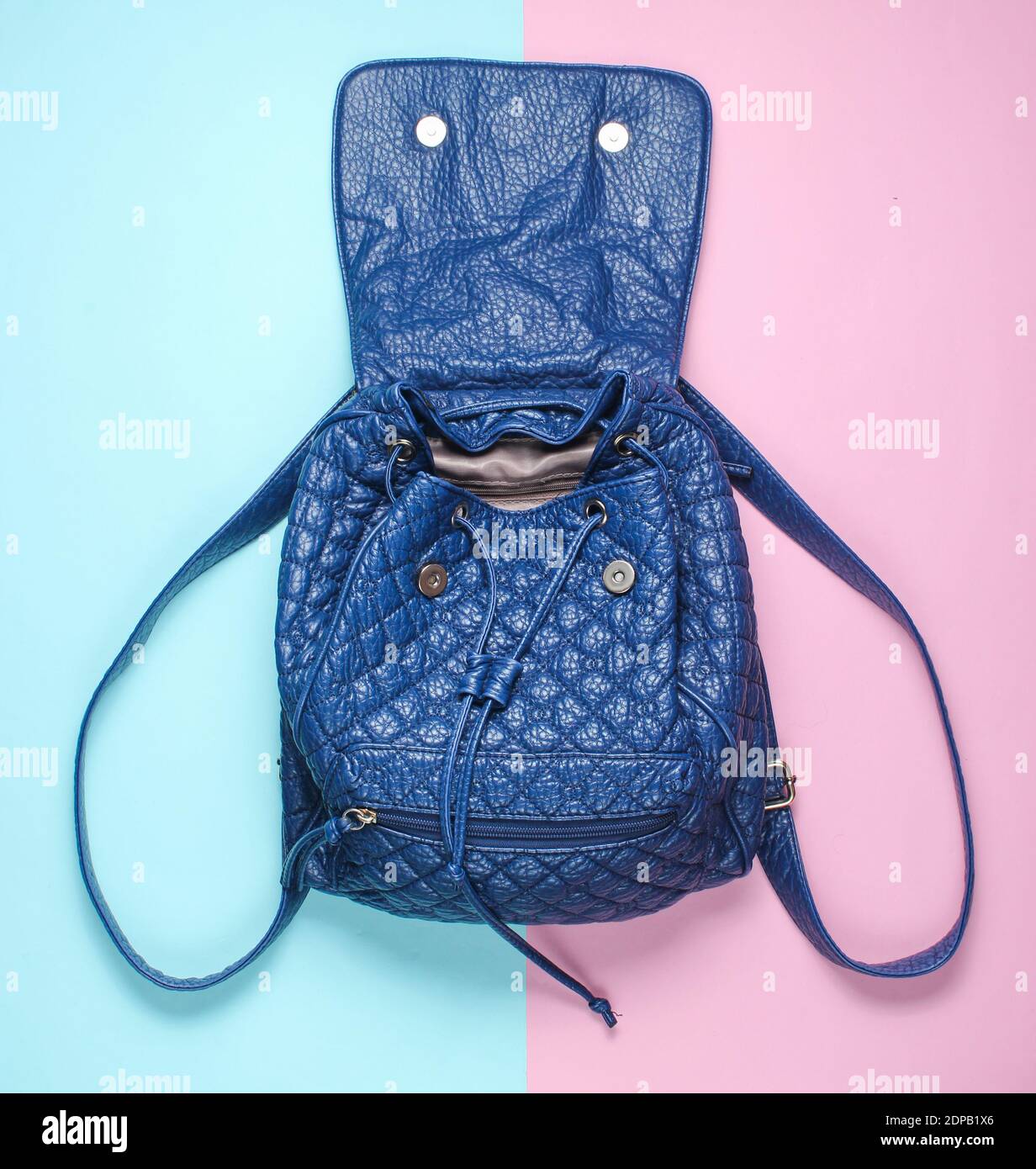 Open leather fashionable backpack on pastel background. top view ...