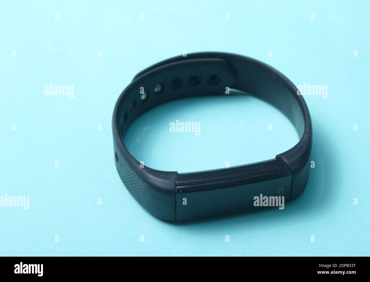 Fitness tracker on a blue background. Minimalism Stock Photo - Alamy