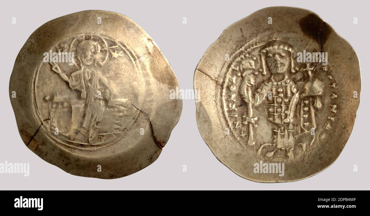 A top view of two gold coins isolated on gray background Stock Photo ...