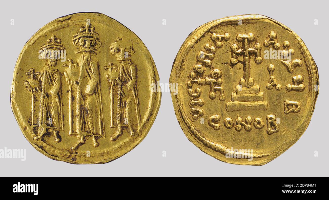 A top view of vintage gold coins isolated on gray surface background ...