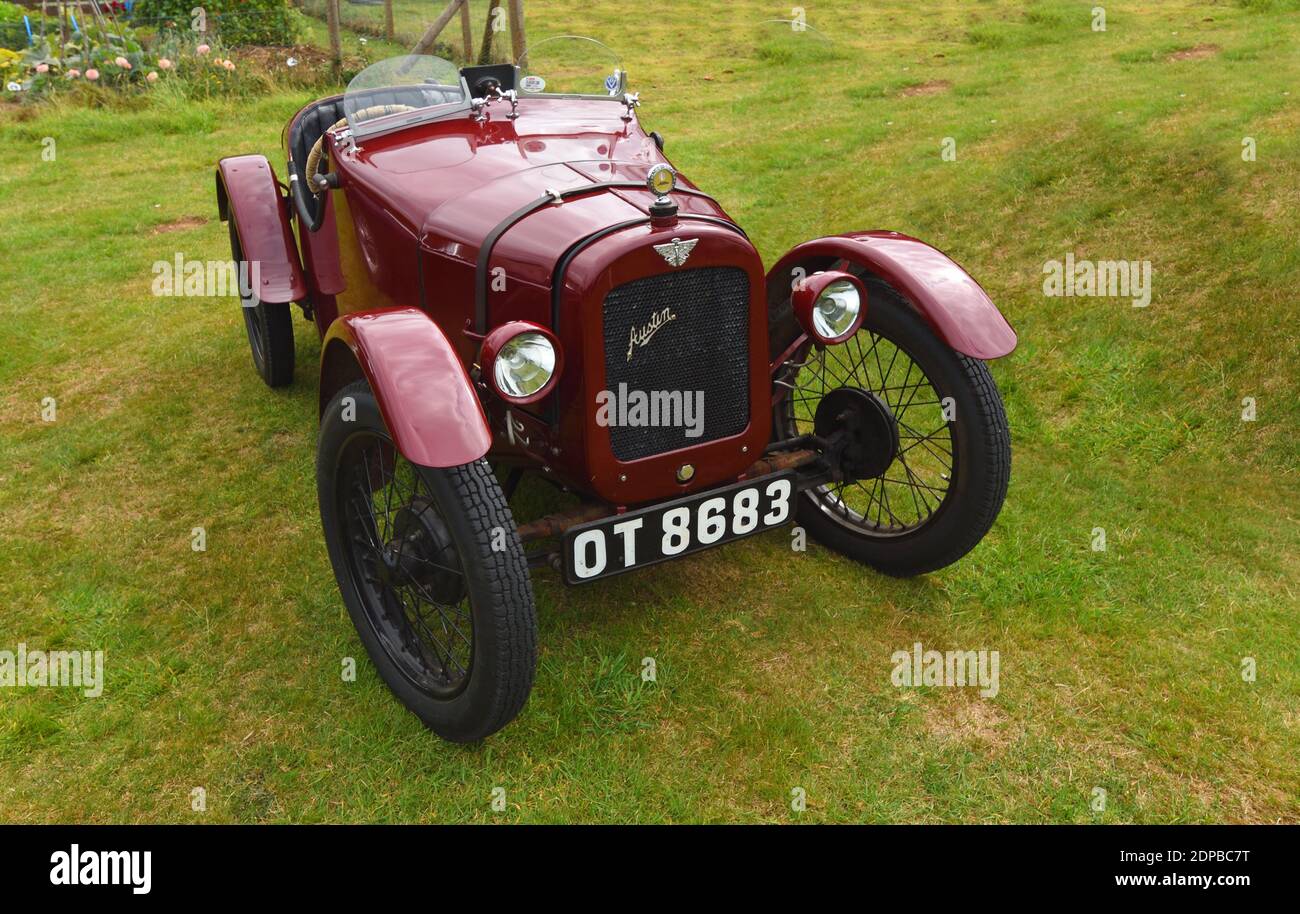 Vintage Dark Red 1928 Austin Seven parked on grass Stock Photo - Alamy