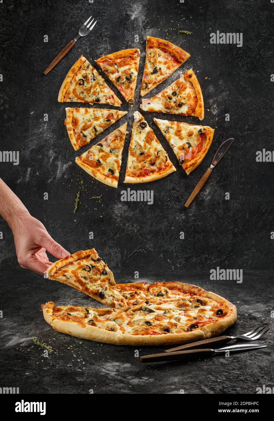 Home made original italian pizza with human hand holding pizza slice ...