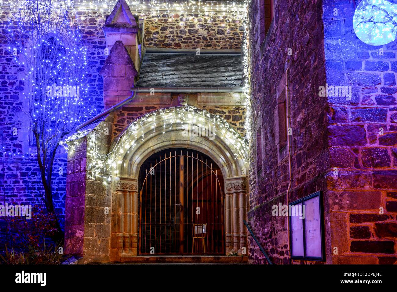 Blue illumination of the stone church Stock Photo - Alamy