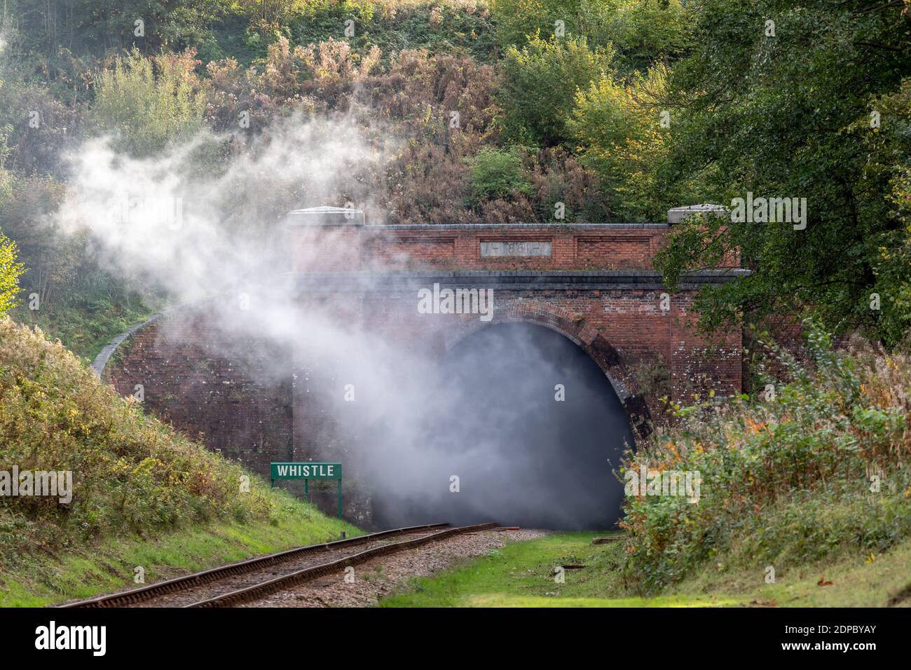Smoke escapes from Sharpthorne tunnel on the Bluebell Railway Stock ...