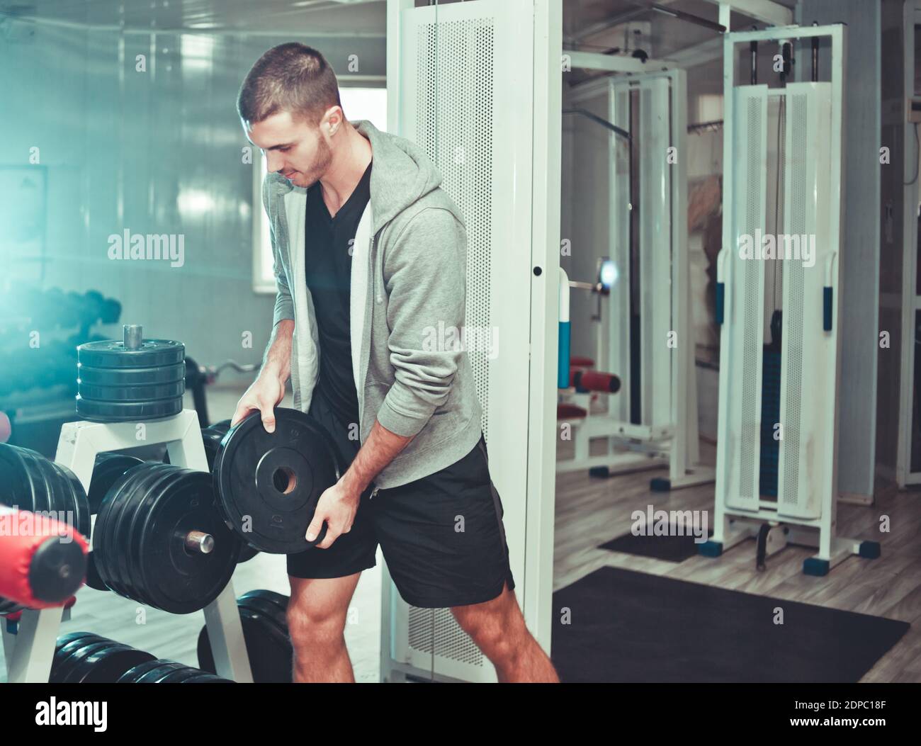 Man pick up heavy hi-res stock photography and images - Alamy