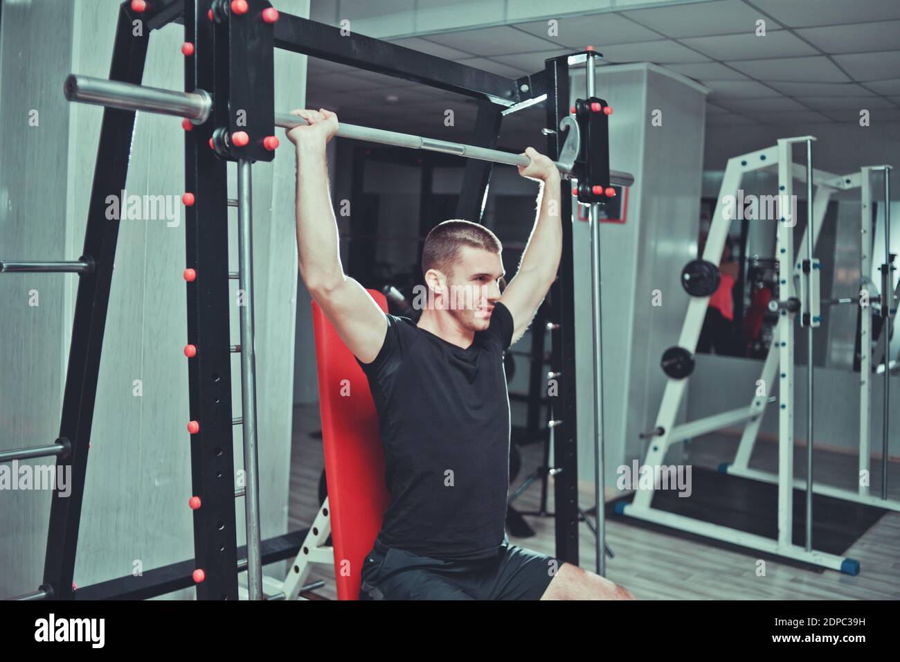 Male bodybuilder trains chest muscles hi-res stock photography and ...