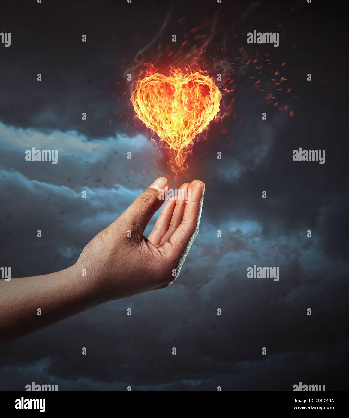 Hand holding fire heart. Symbolize giving love concept Stock Photo - Alamy