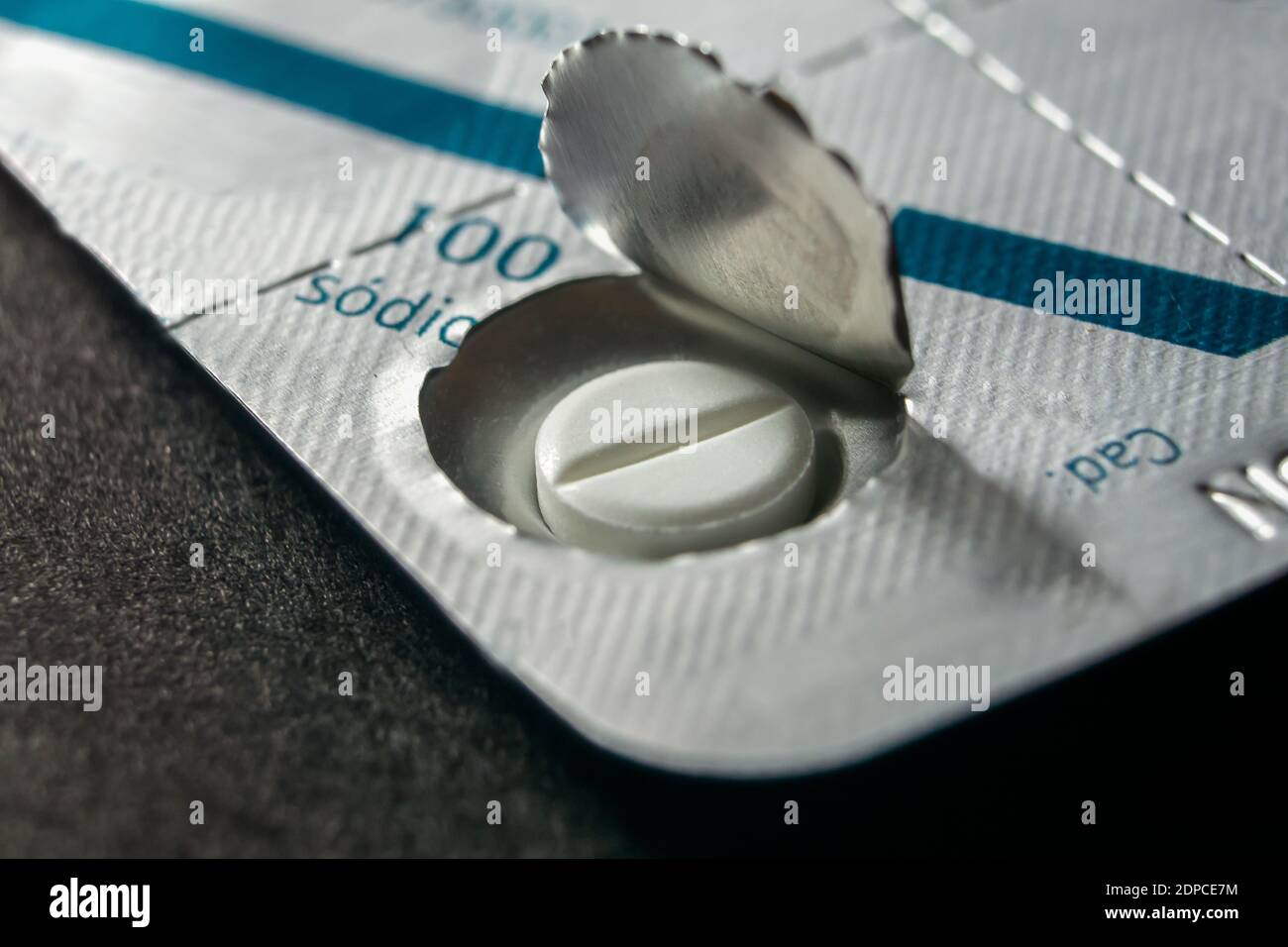A shot of an opened pile with a medical tablet on a black surface Stock ...