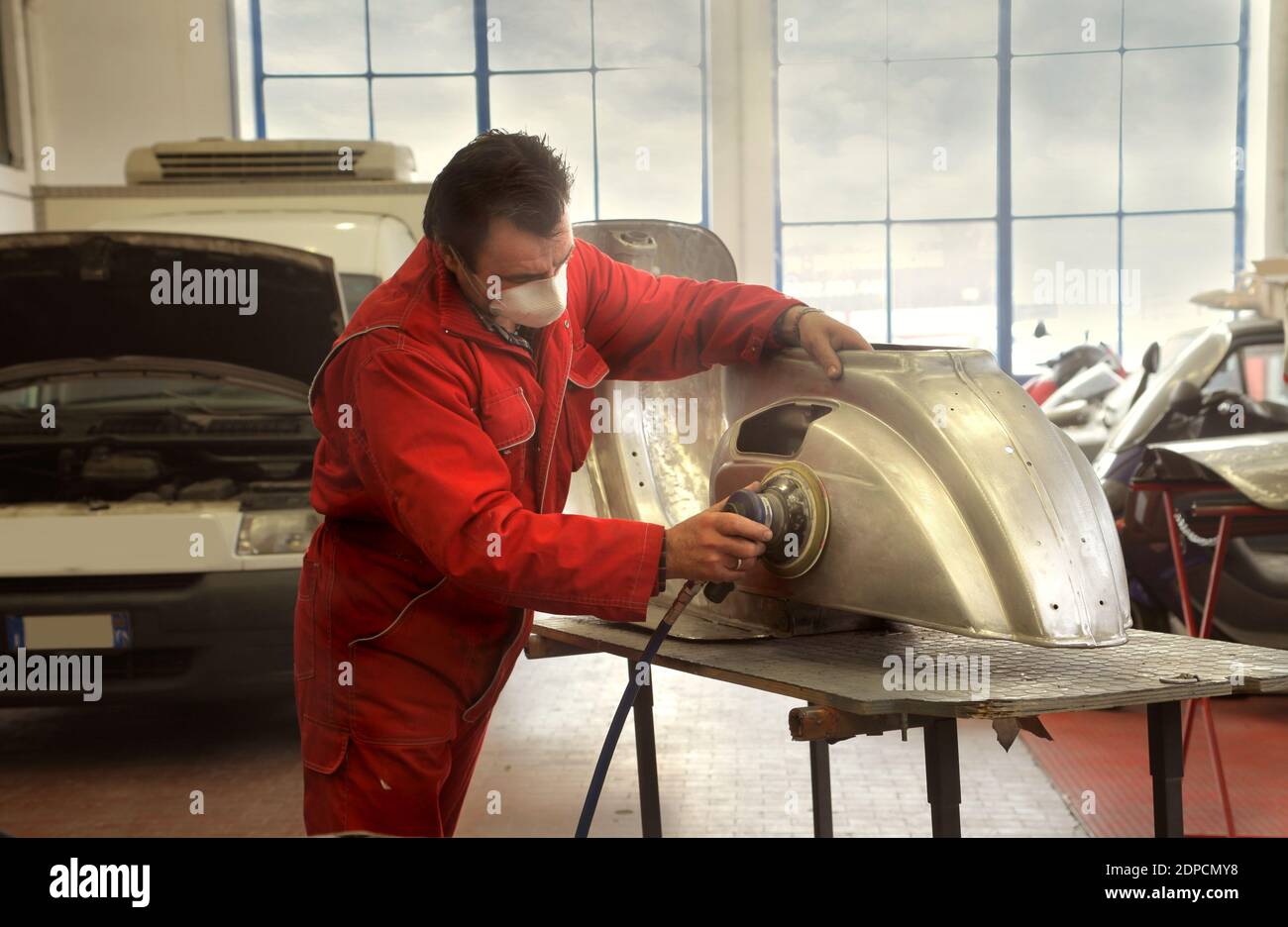 A middle-aged European mechanic working in a garage Stock Photo - Alamy