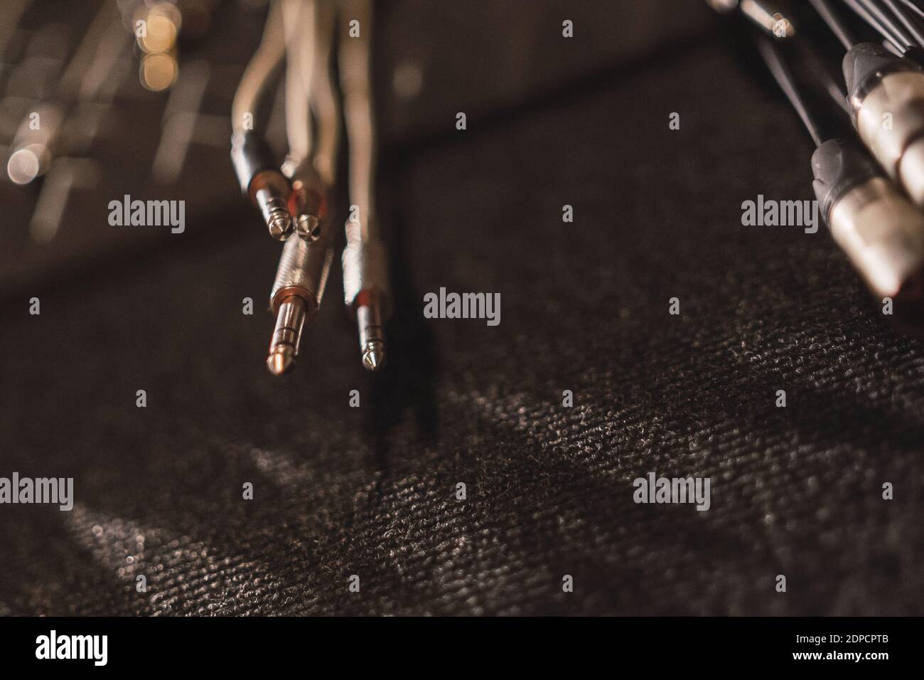 A horizontal shot of round-end cables hanging on the wall Stock Photo ...