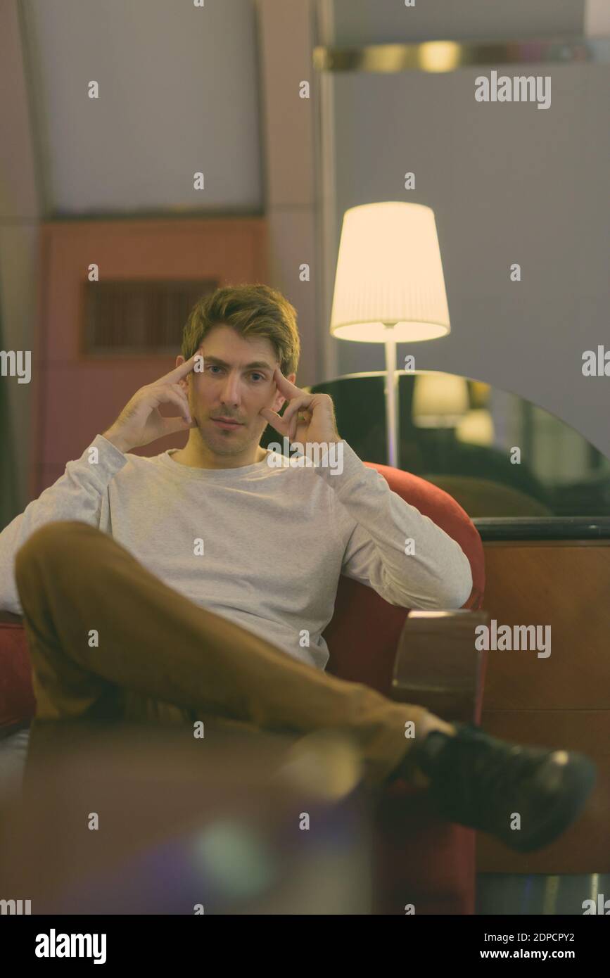 Handsome man relaxing at the mall in Bangkok, Thailand Stock Photo - Alamy