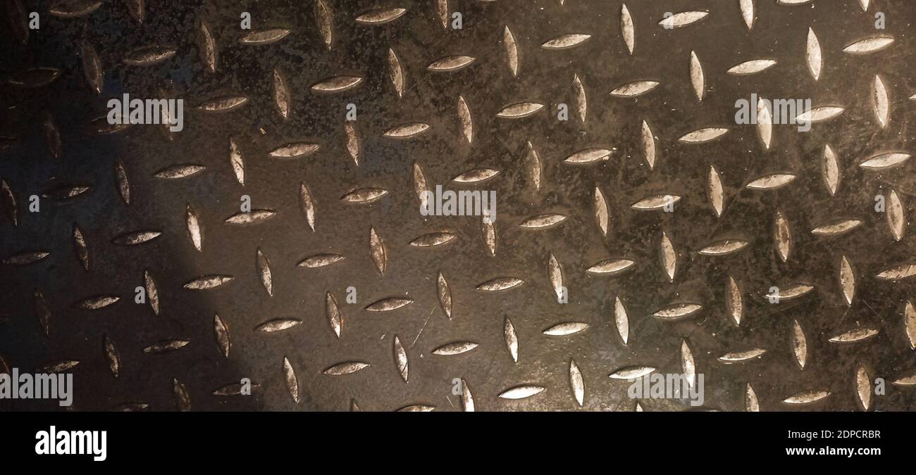 Embossed metal texture with traces of black and blue paint Stock Photo ...