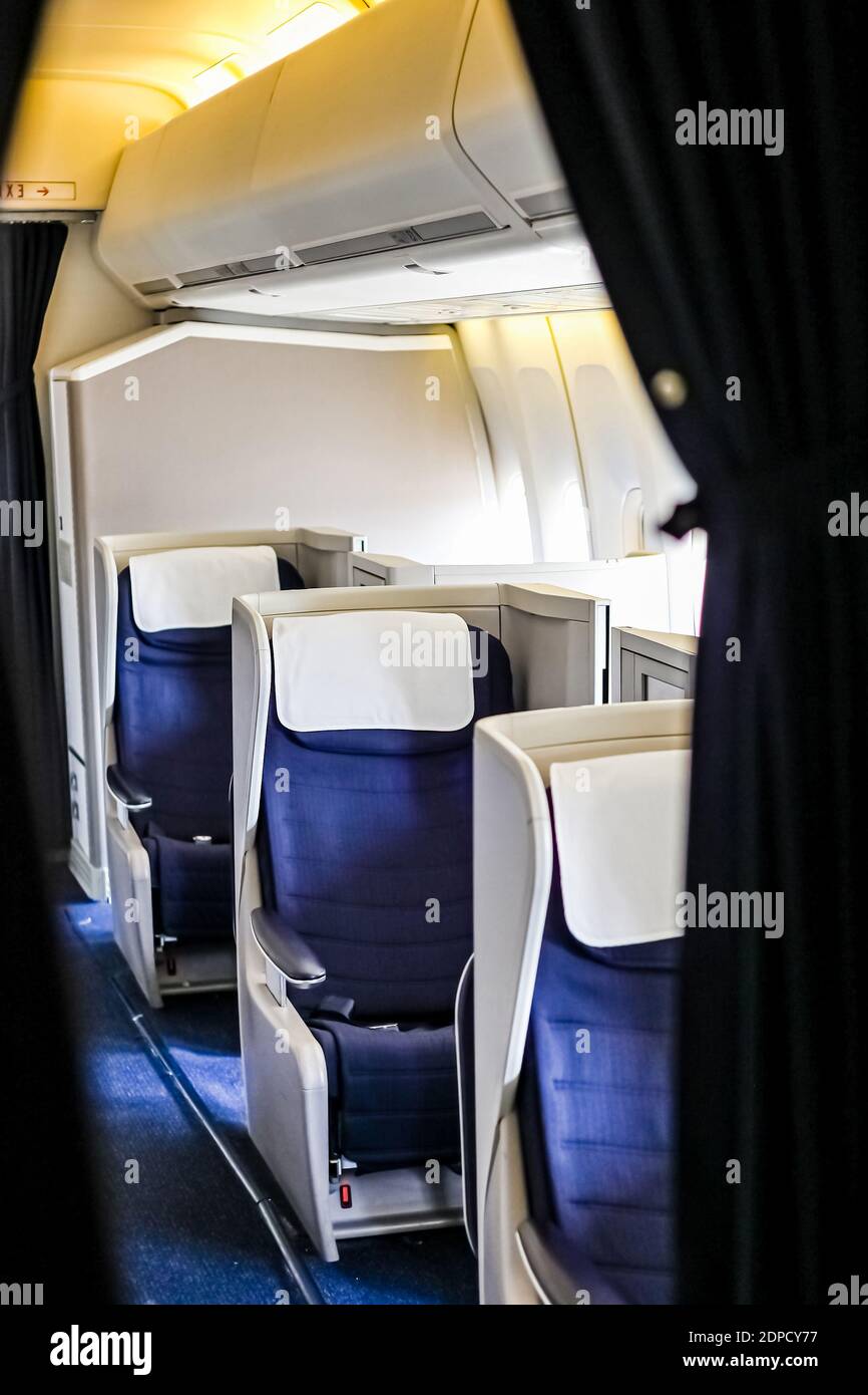 A vertical shot of airplane business class cabin Stock Photo - Alamy