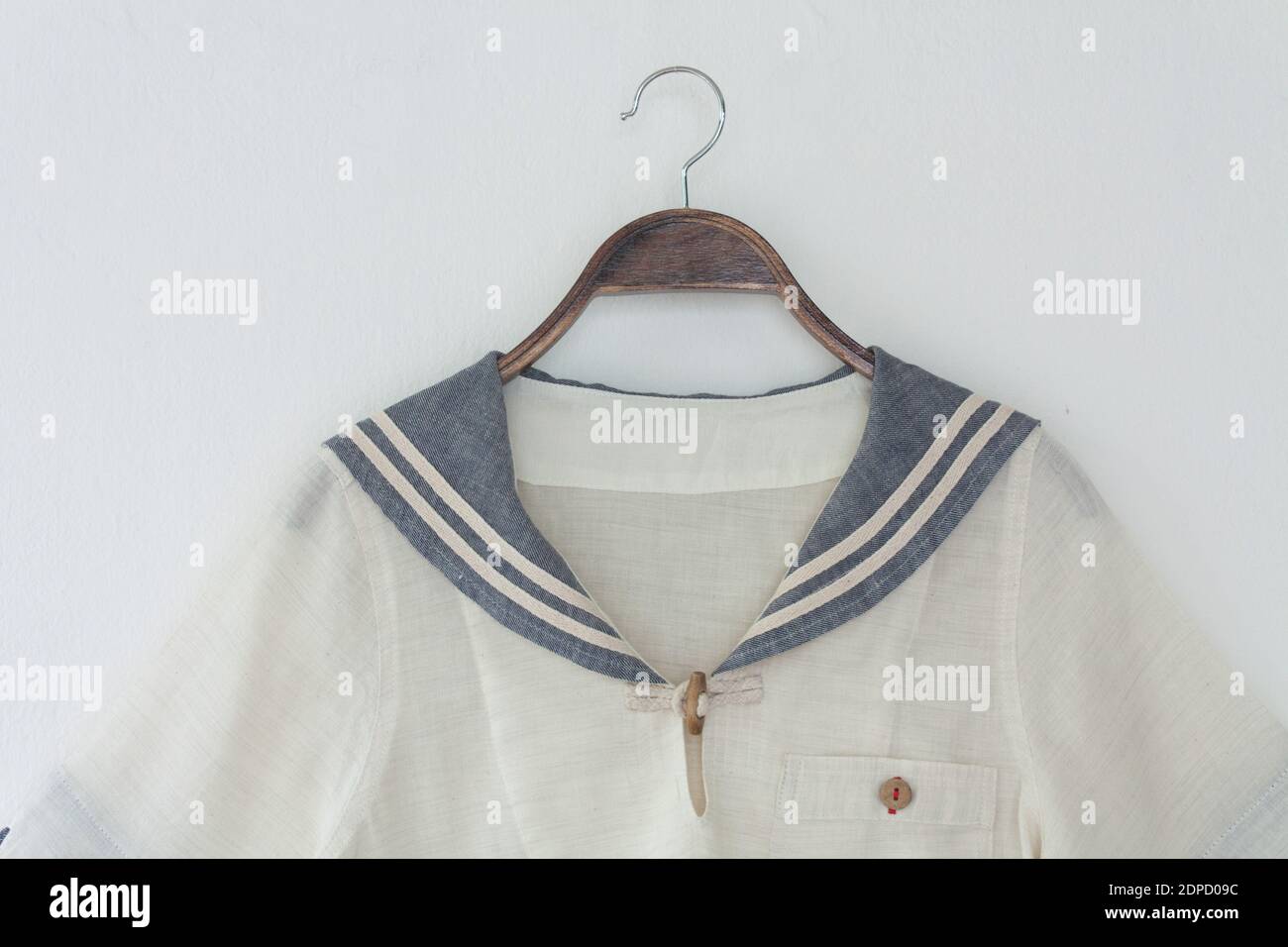 Cloth Hanging Over White Background Stock Photo - Alamy