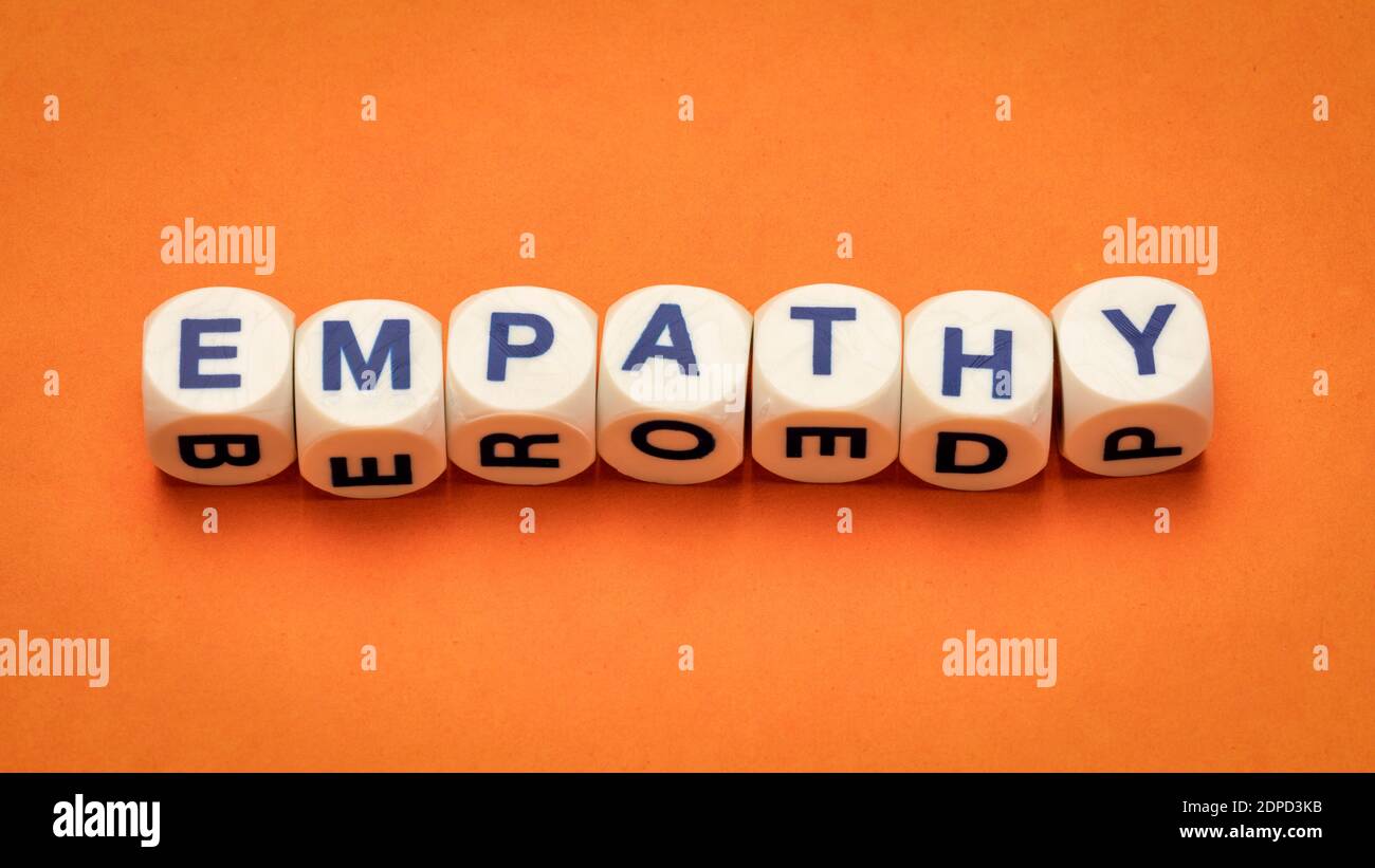 empathy word abstract in dice letters against handmade orange paper ...