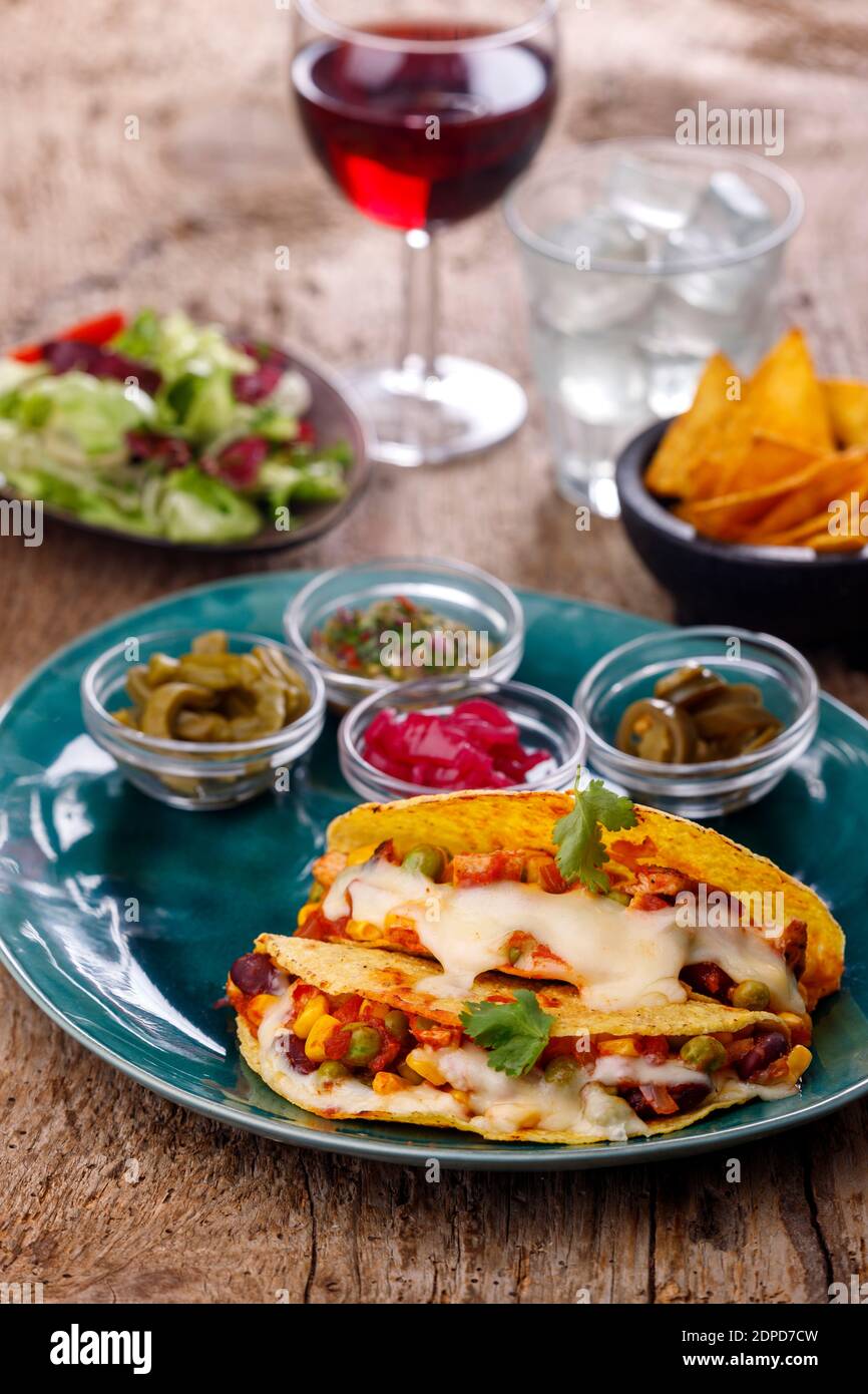 mexican tacos baked with cheese Stock Photo - Alamy