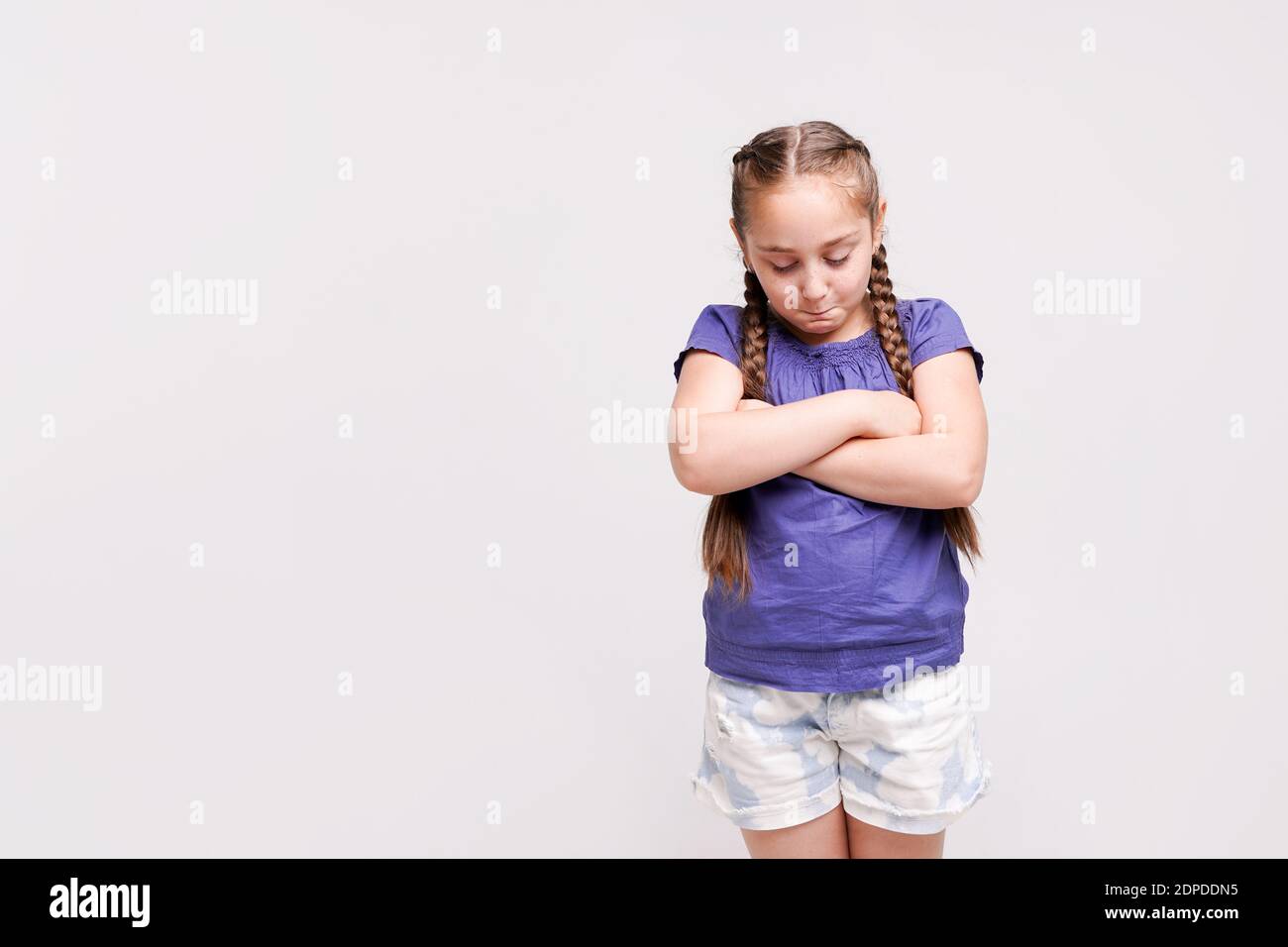 Little sad upset confused kid teen girl posing isolated on white ...