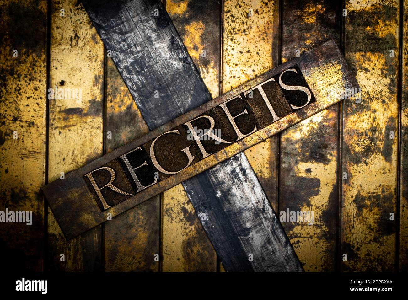 Regrets text on grunge textured copper and gold background Stock Photo ...