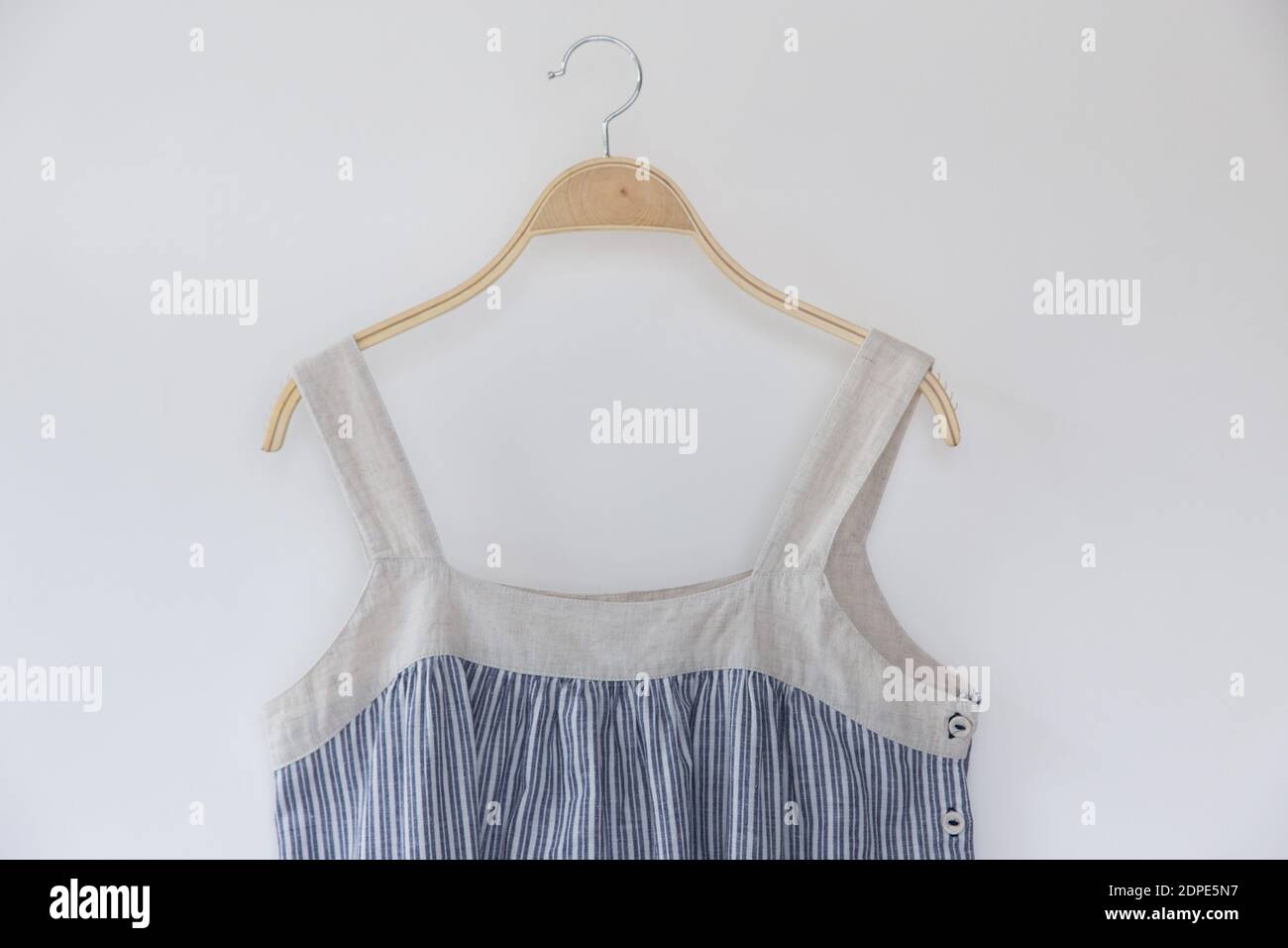 Top Hanging Against White Background Stock Photo - Alamy