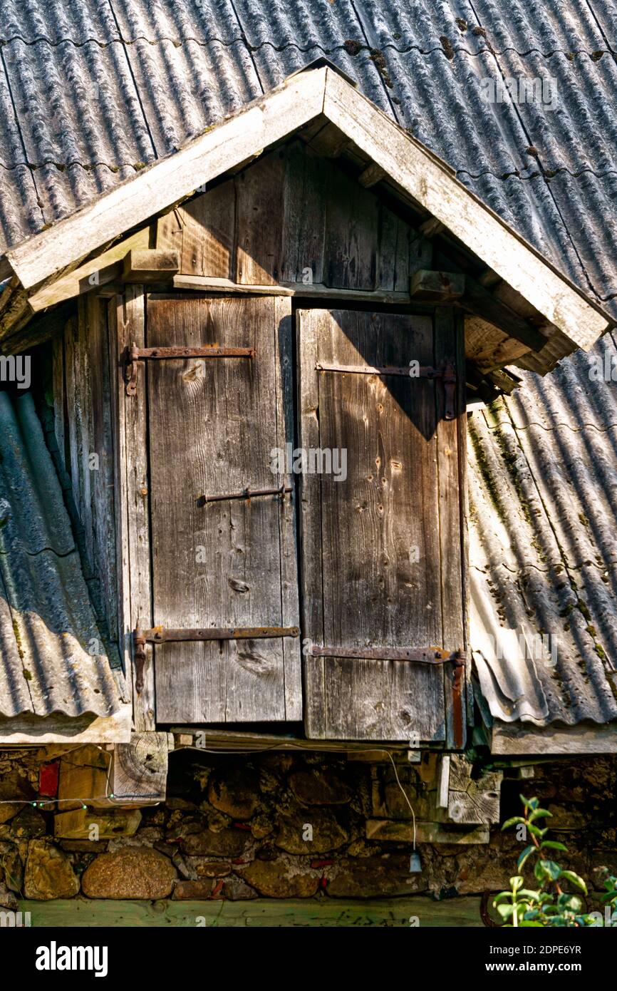 Small shuttered wooden window in an old barn Stock Photo - Alamy