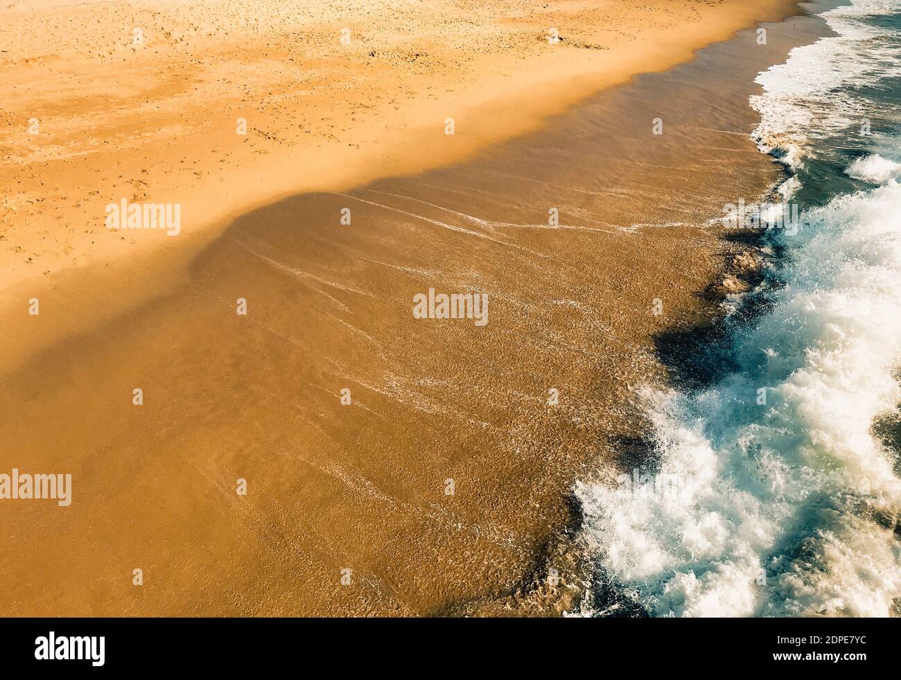 An aerial overhead shot of the sea waves against the seashore Stock ...