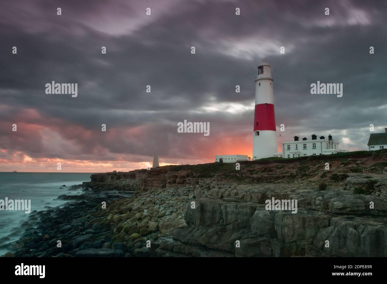 Sun setting behind Portland Bill Lighthouse Stock Photo - Alamy