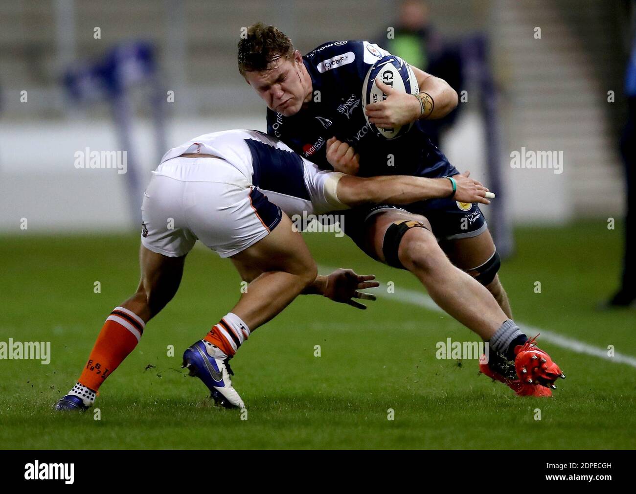 Sale Sharks' Cobus Wiese (right) is tackled by Edinburgh Rugby's Jaco ...