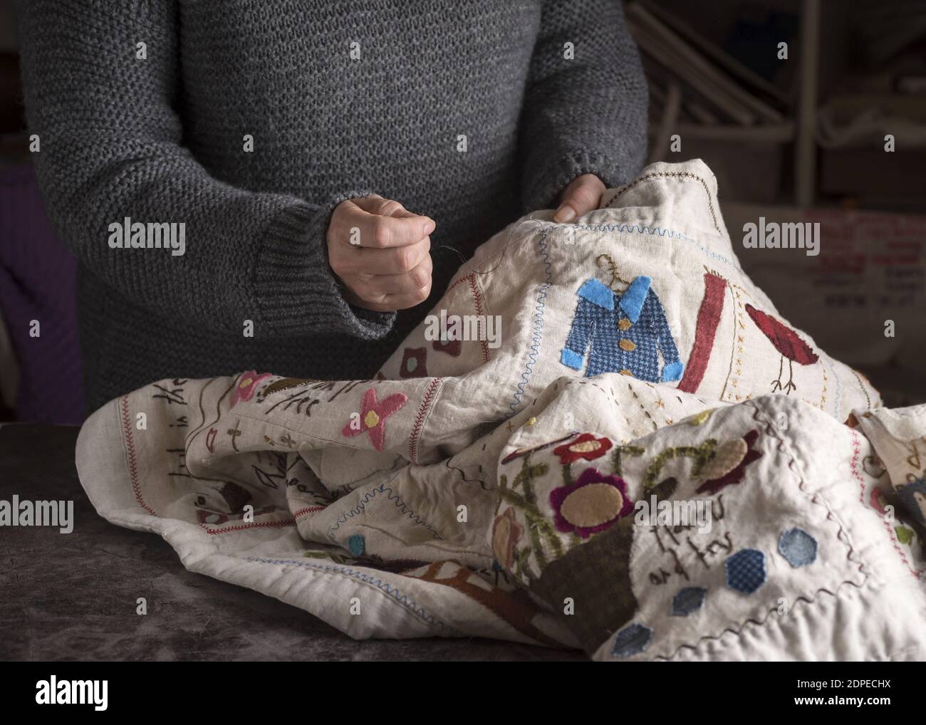 Woman sewing a blanket hi-res stock photography and images - Alamy