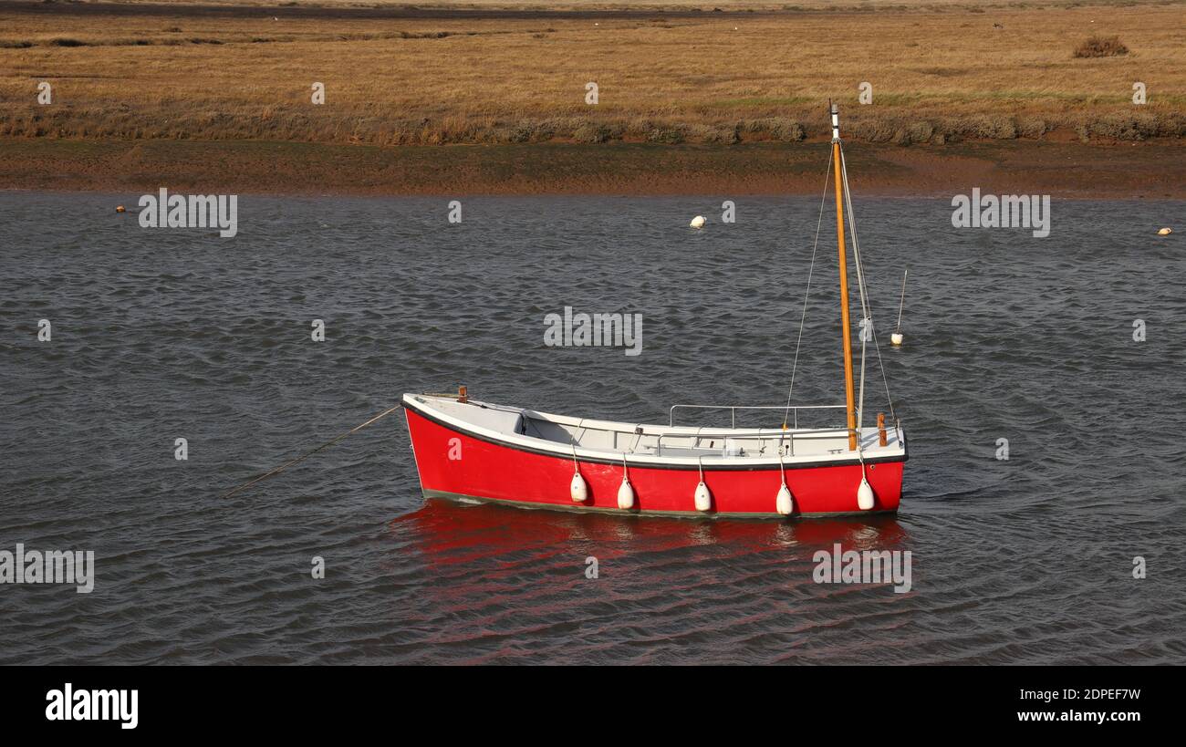 red boat by the seaside Stock Photo - Alamy