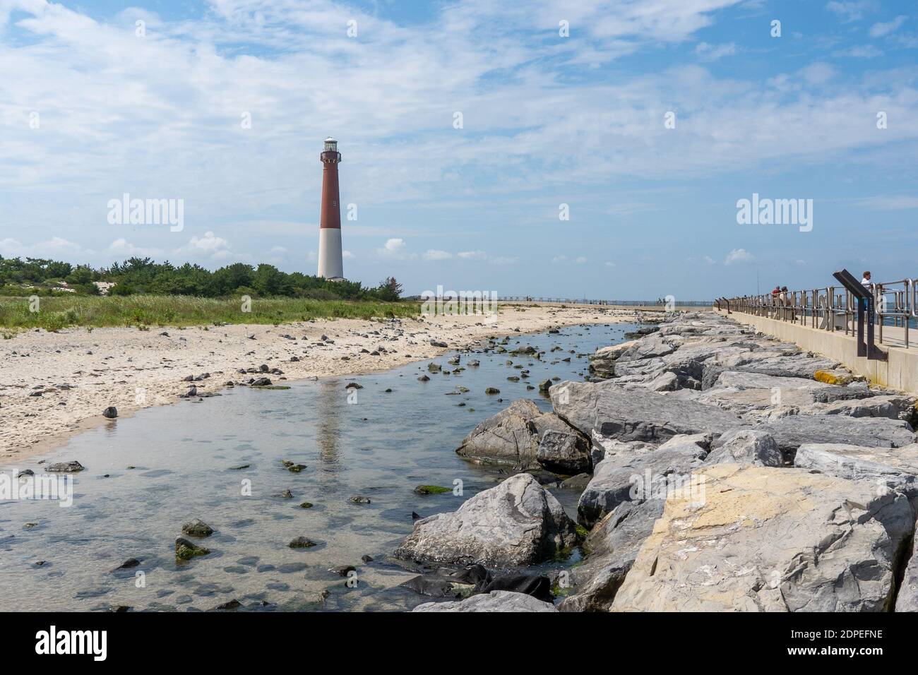 The majestic Barnegat Lighthouse on the shore of the sea Stock Photo ...