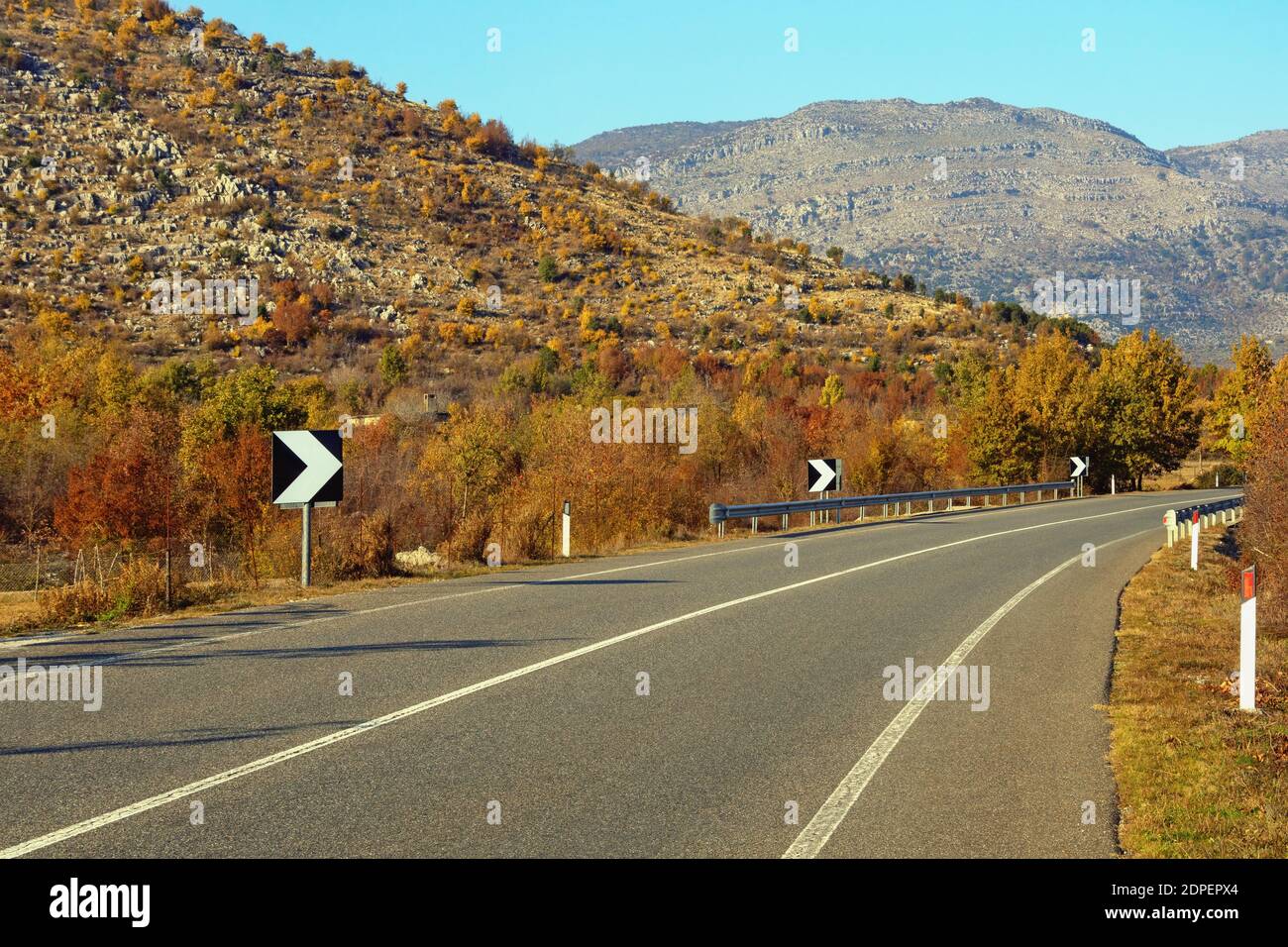 Autumn road trip through the Balkans. Albania. Turn right traffic signs ...