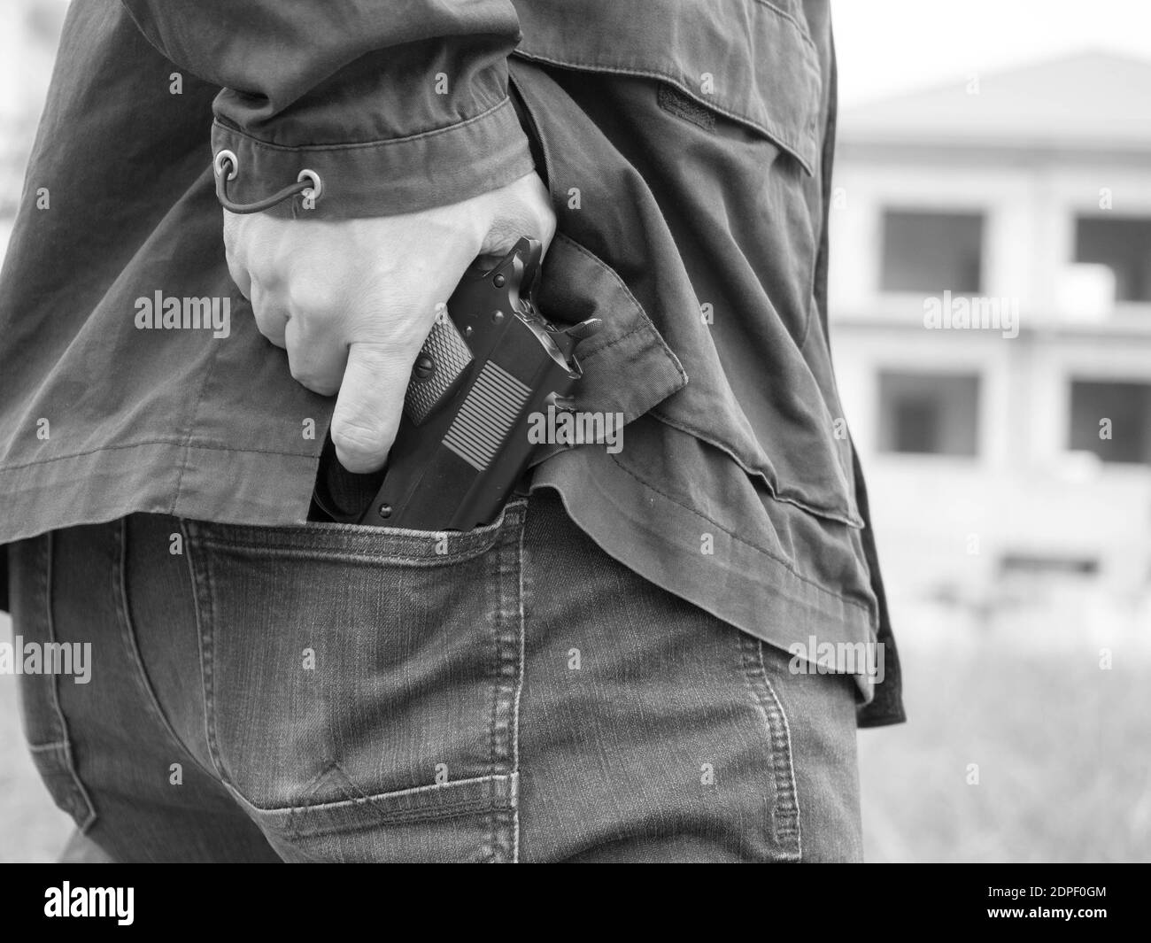 Hand holding gun close up Black and White Stock Photos & Images - Alamy