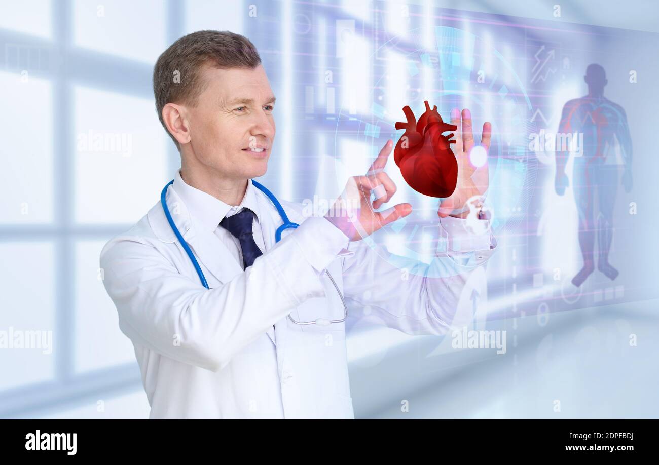 Male cardiologist using virtual screen in clinic Stock Photo - Alamy