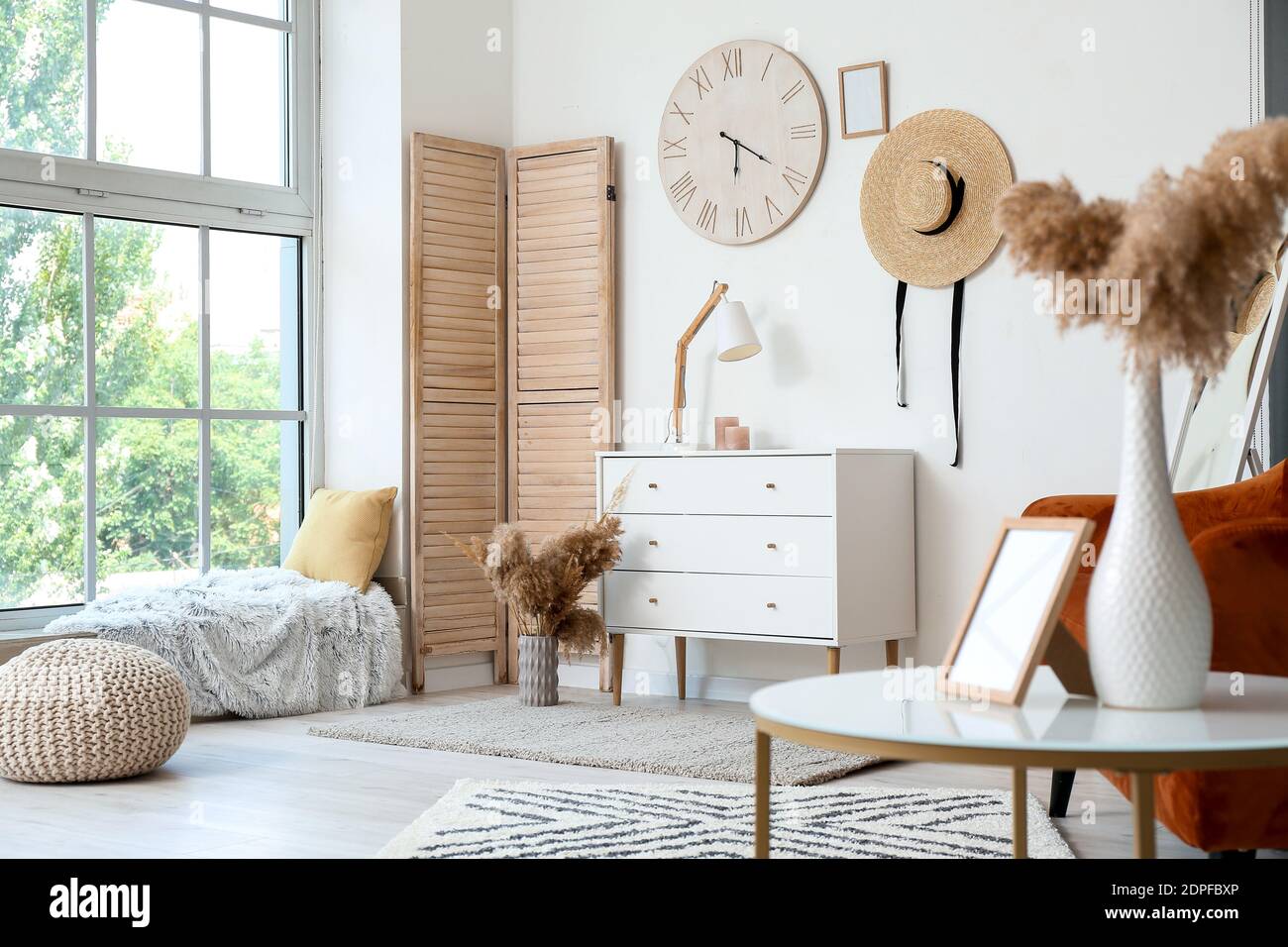 Interior of modern living room with chest of drawers Stock Photo - Alamy