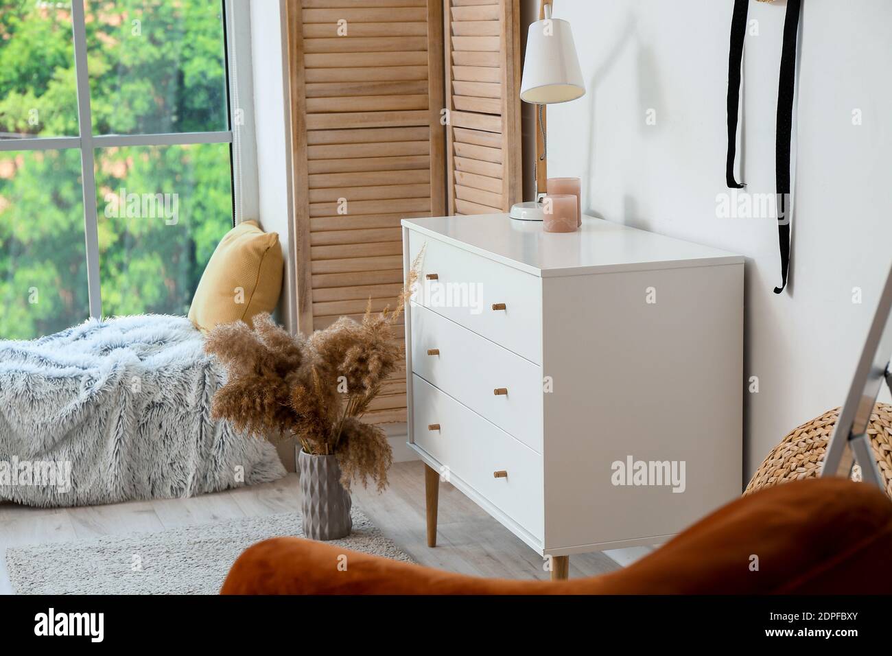 Interior of modern room with chest of drawers Stock Photo - Alamy