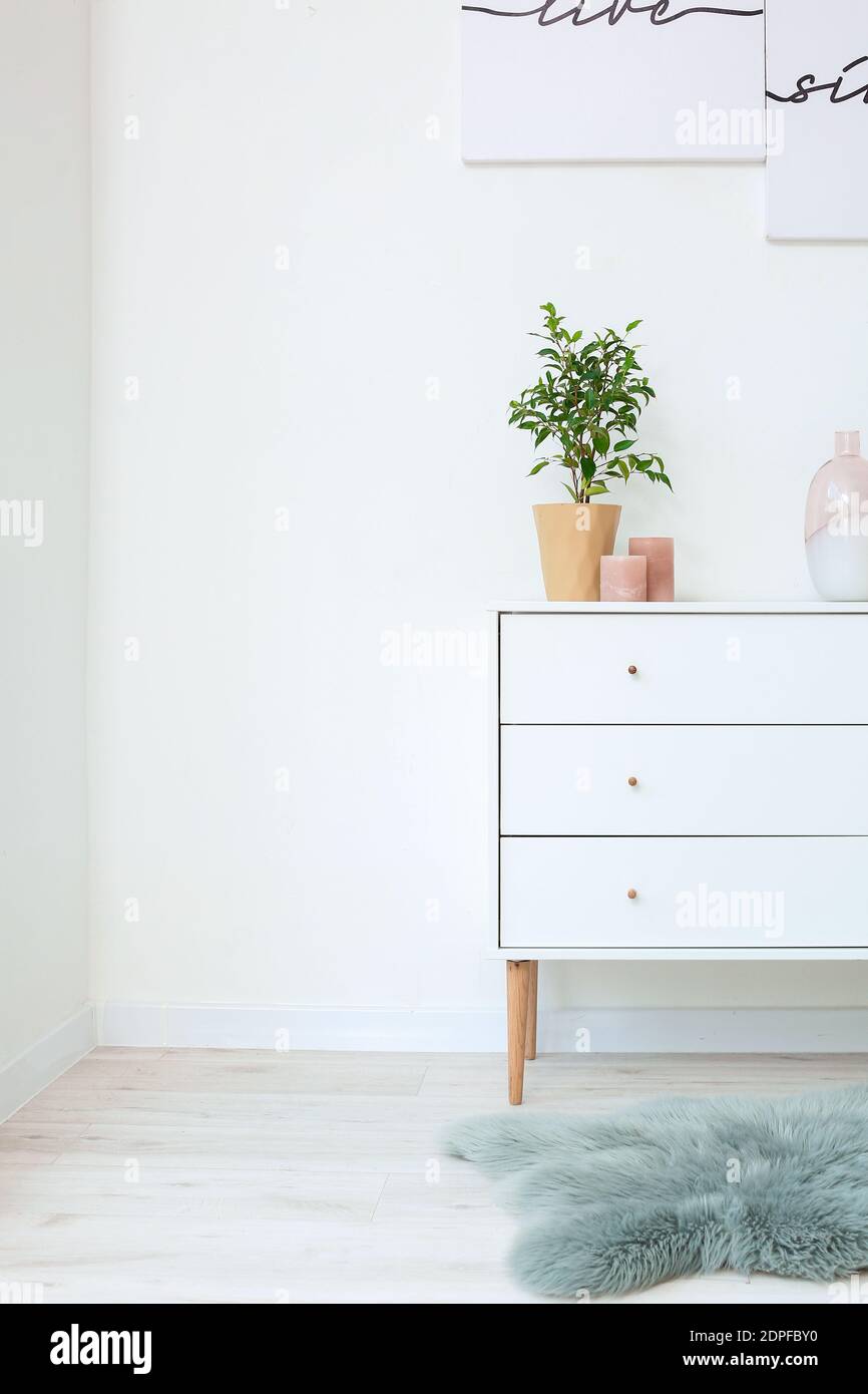 Modern interior of living room with chest of drawers Stock Photo - Alamy
