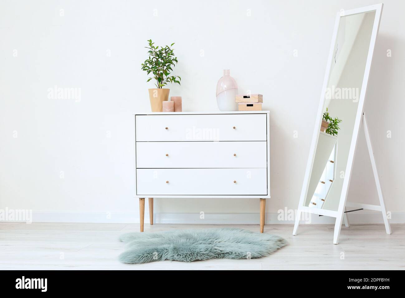 Modern interior of living room with chest of drawers Stock Photo - Alamy
