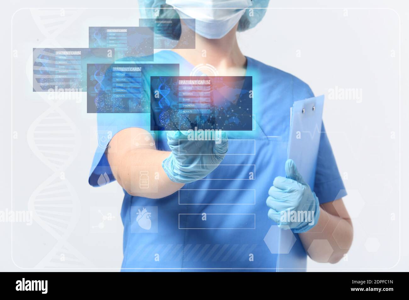 Doctor choosing electronic card of patient on light background ...