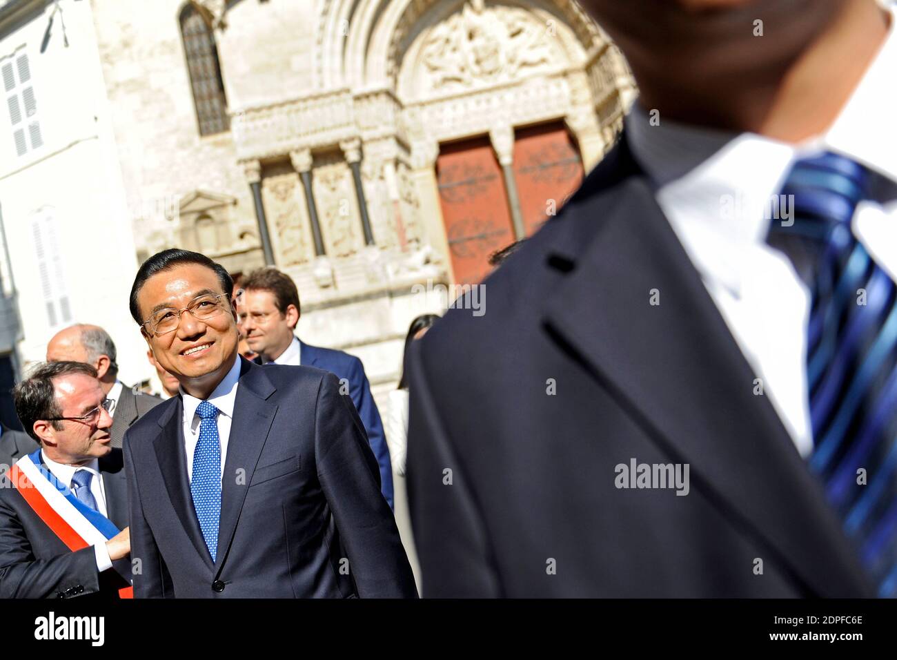 Chinese Prime Minister Li Keqiang walks the streets after a visit to ...