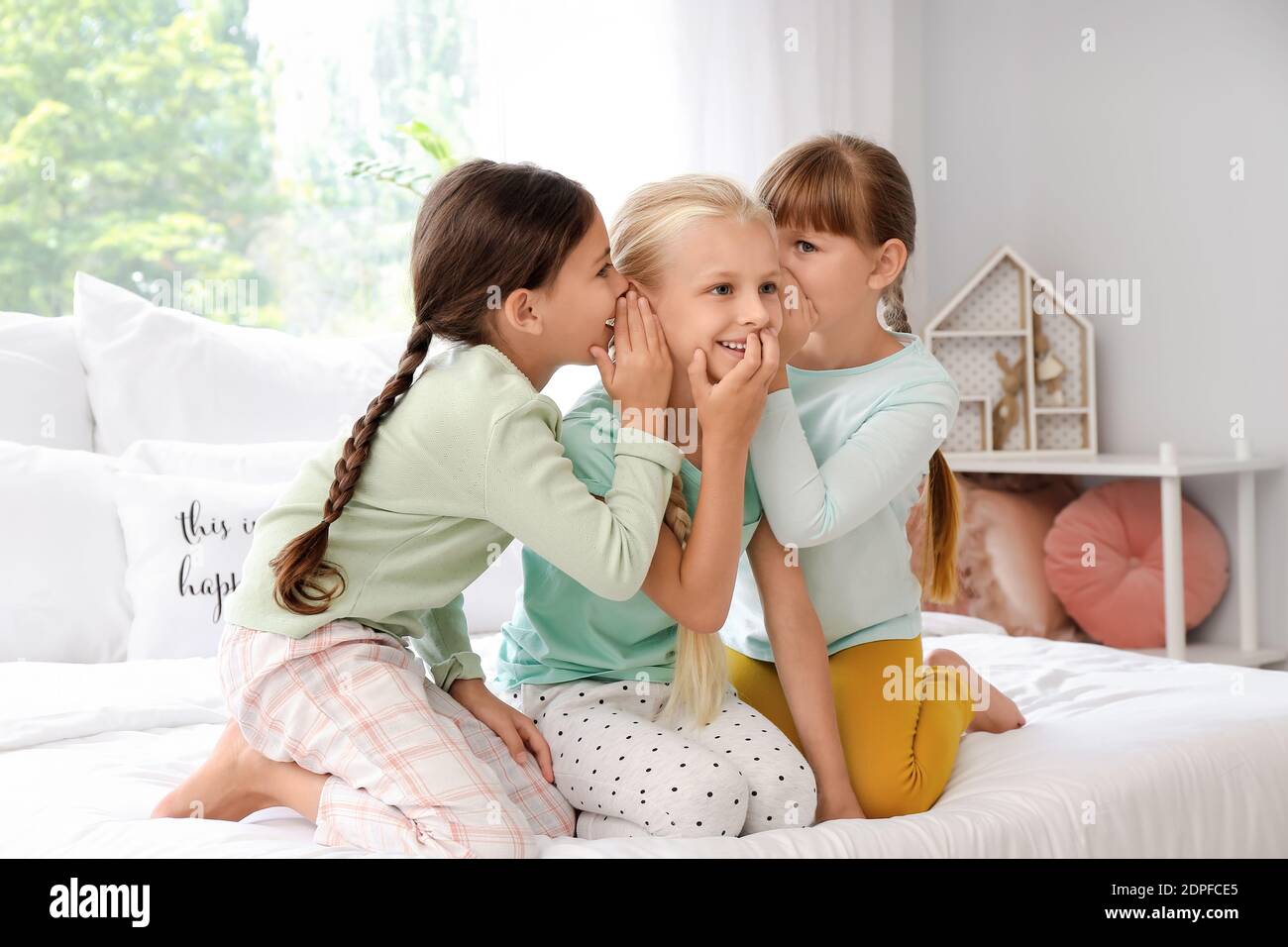 Telling secrets hi-res stock photography and images - Alamy