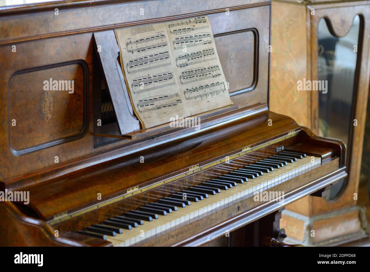 Vintage antique brown wooden piano music instrument Stock Photo - Alamy