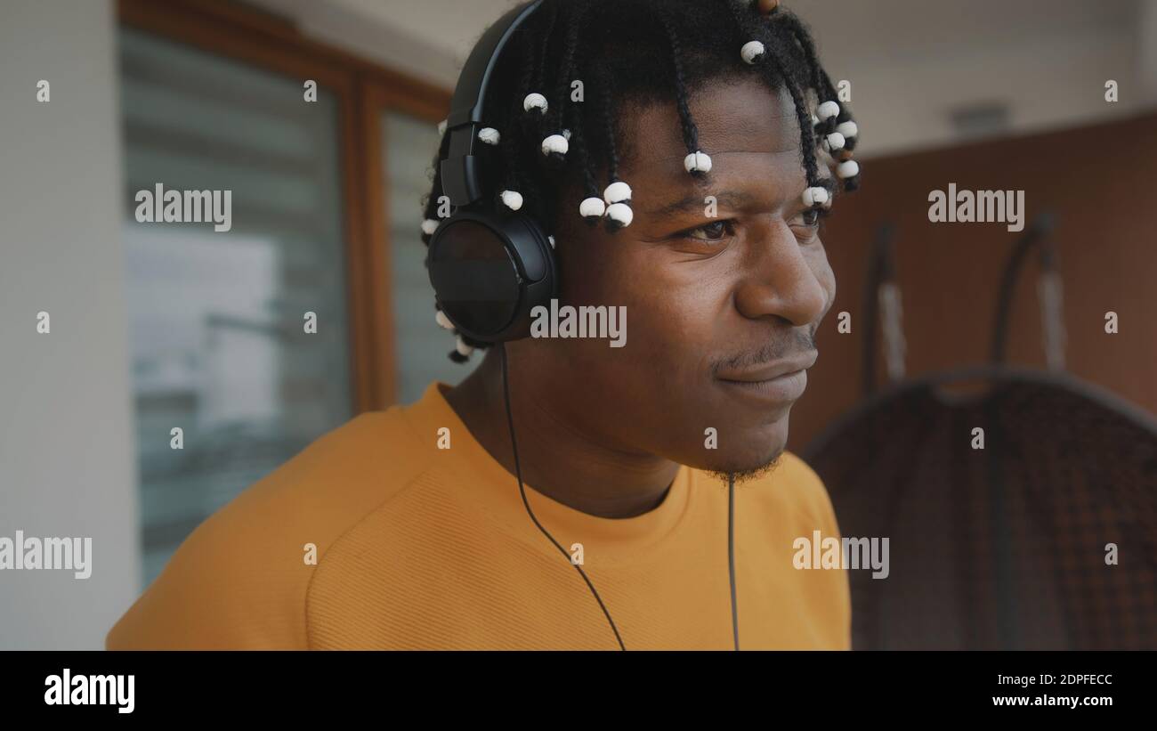 Portrait of happy african american black man dancing while listening to ...