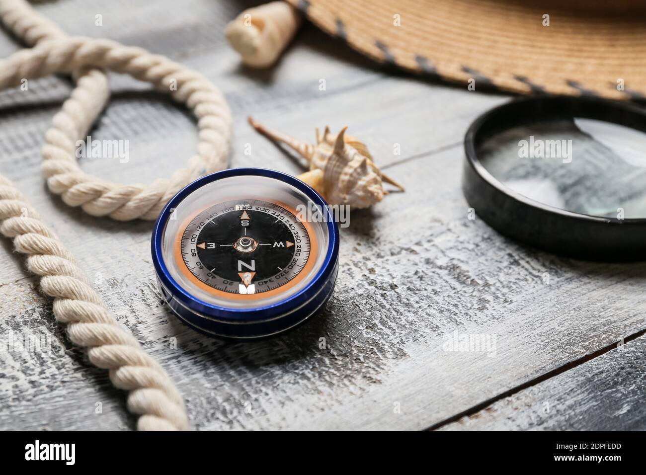 Rope and compass on light background Stock Photo - Alamy