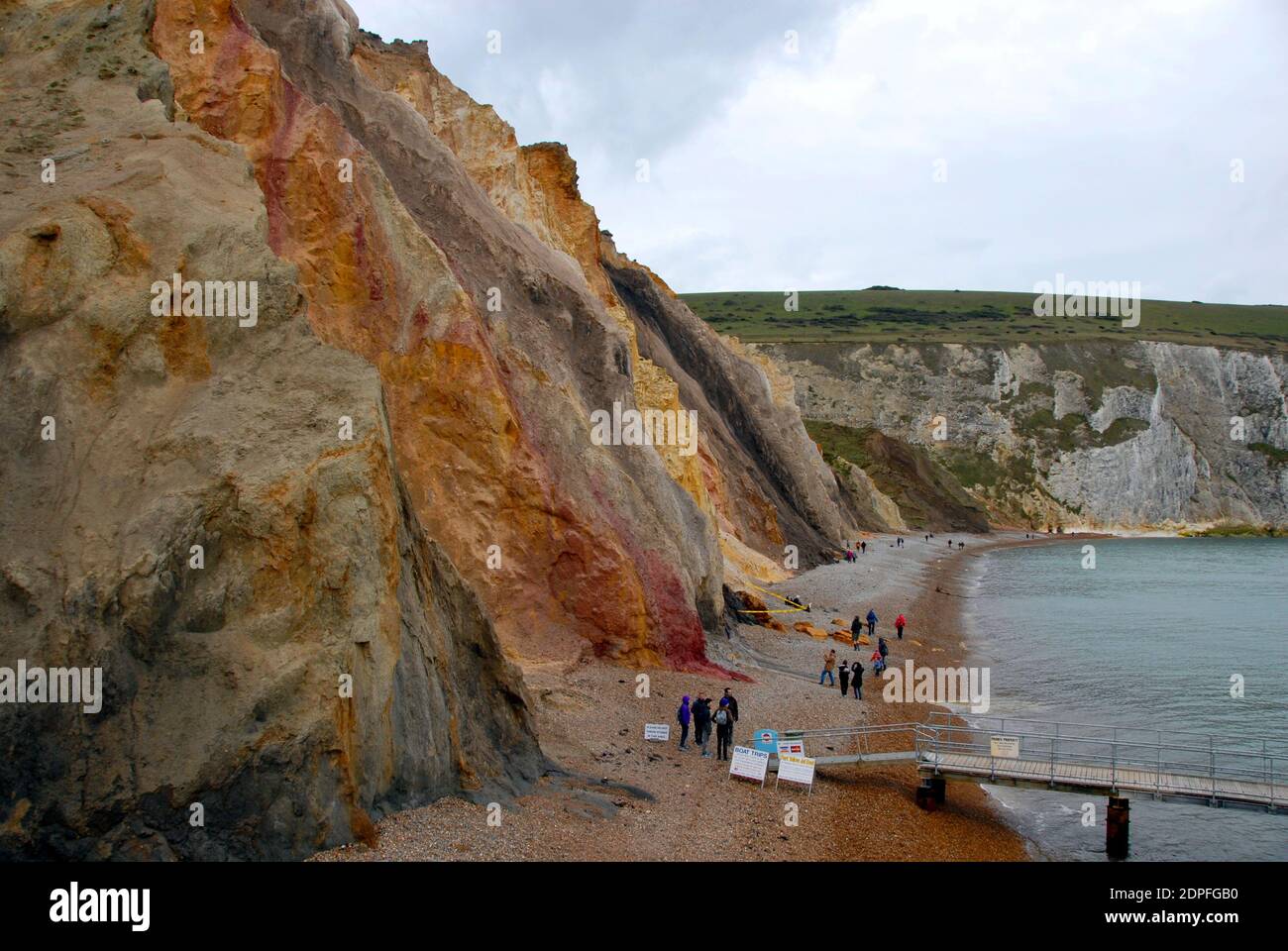 Part of the beach and the multi-colored sands in the cliffs, Alum Bay ...