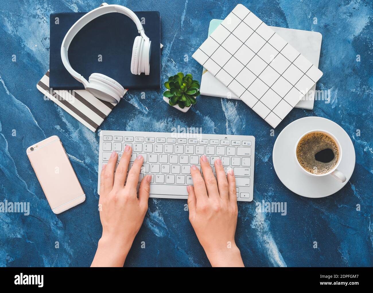 Female hands with computer keyboard, gadgets and gadgets on table Stock ...