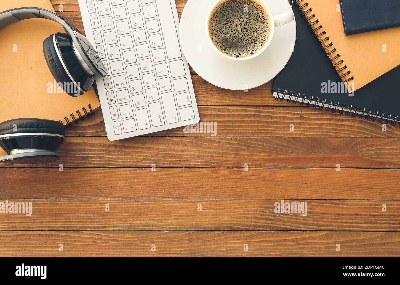 Computer keyboard, cup of coffee and gadgets on wooden background Stock ...