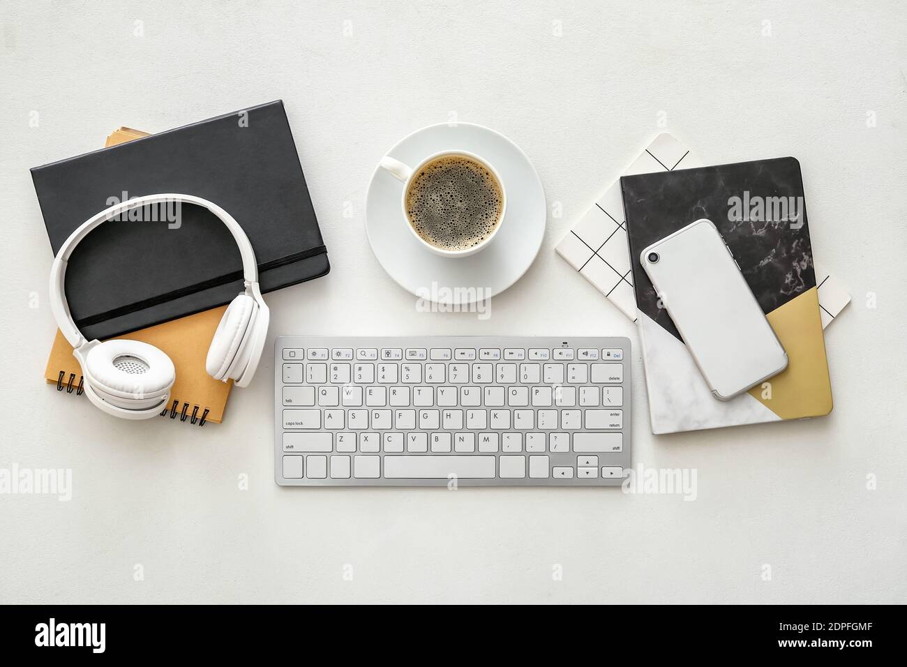 Computer keyboard, notebooks and gadgets at workplace Stock Photo - Alamy