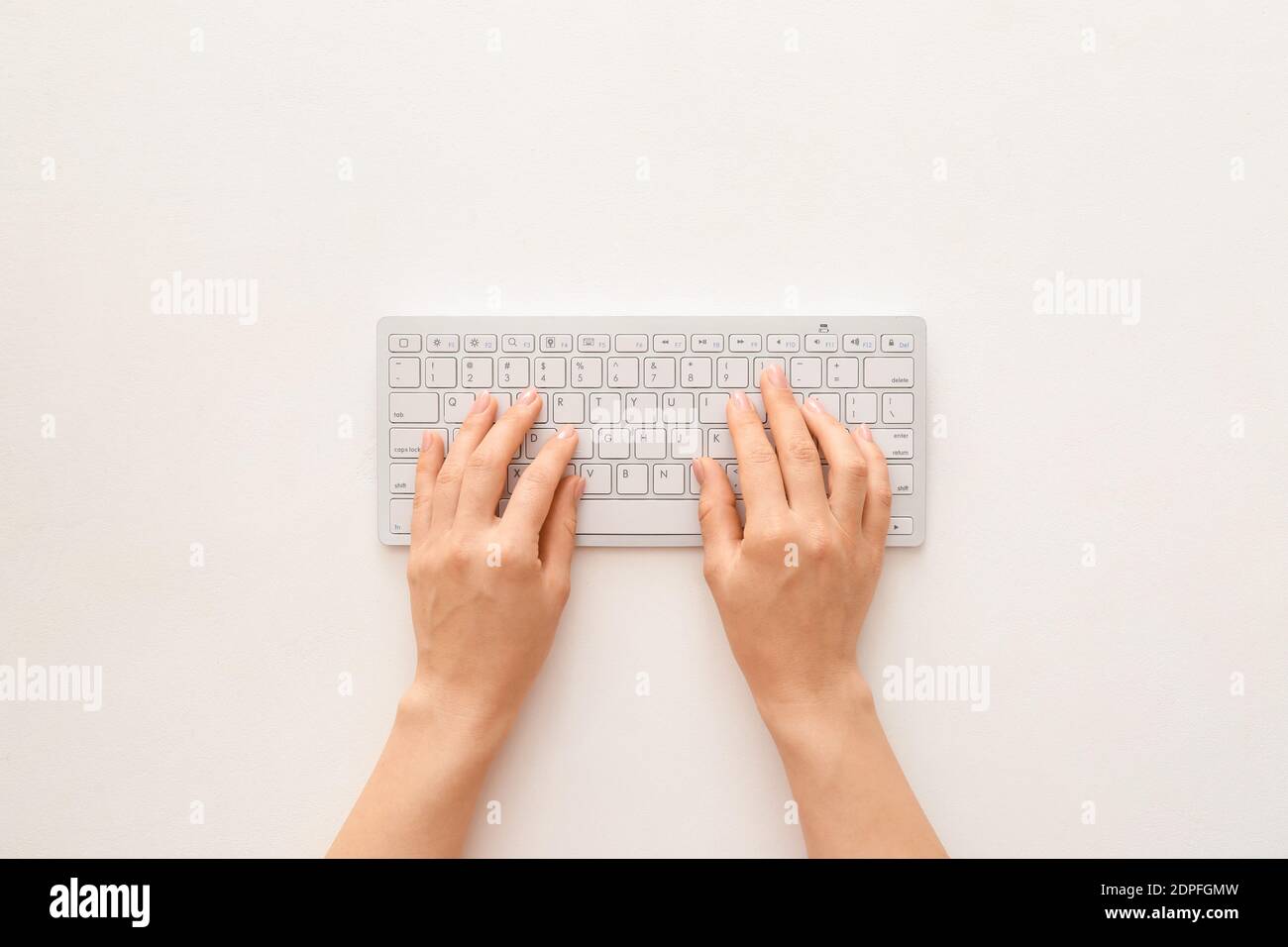 Female hands with computer keyboard on white background Stock Photo - Alamy